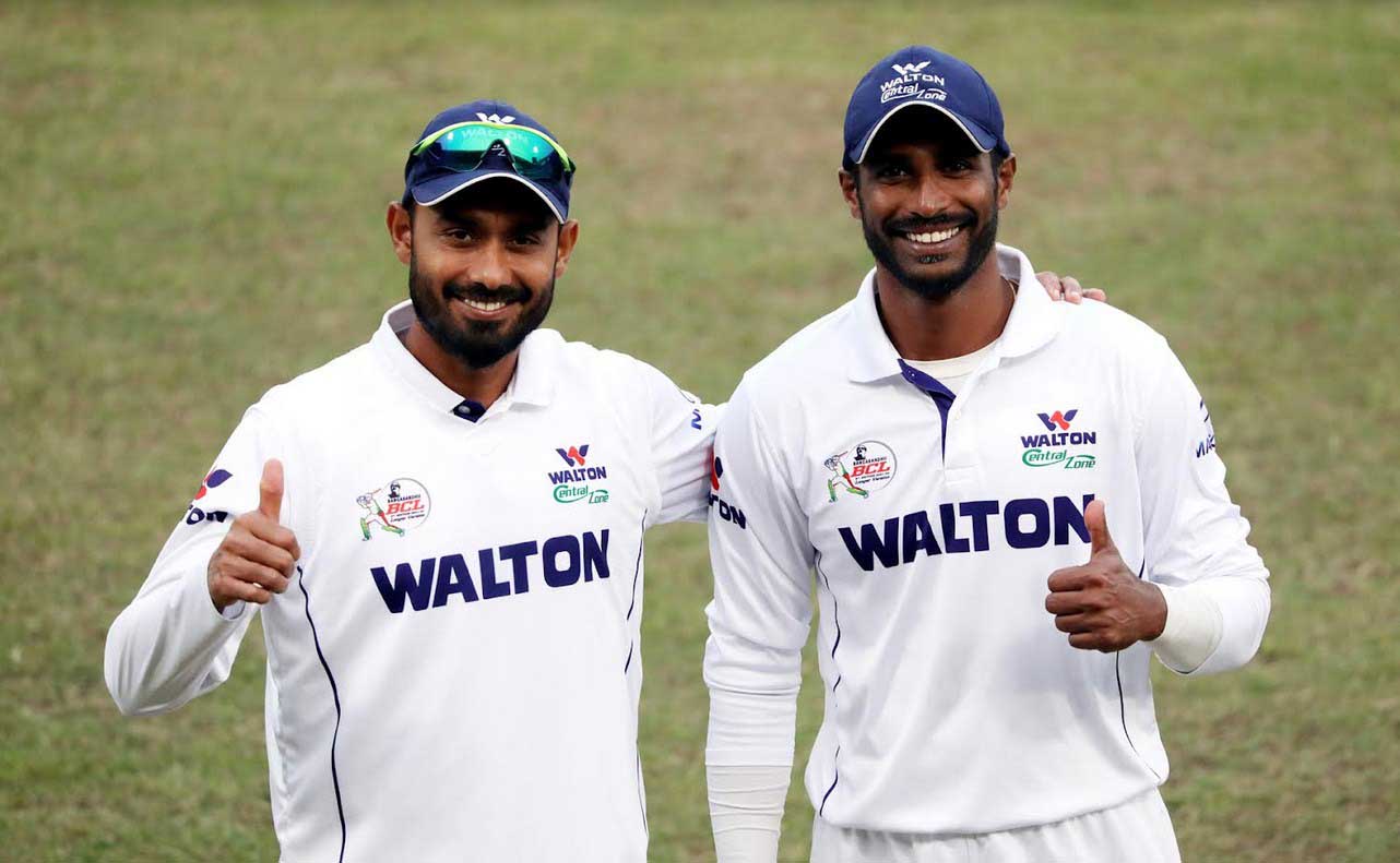 Double centurion Mohammad Mithun and centurion Shuvagata Hom pose for a ...